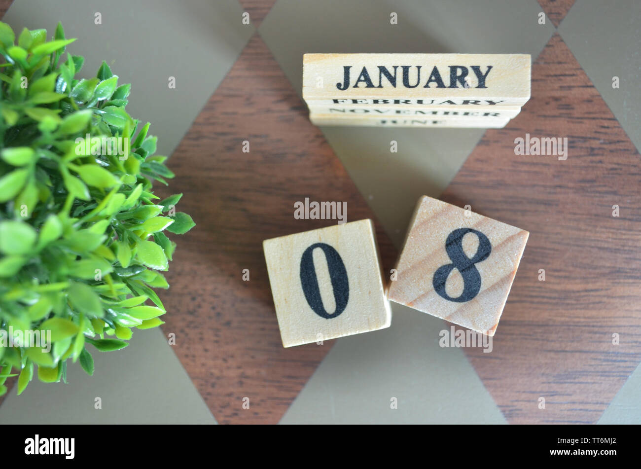 Date of February month with leaf on diamond pattern table for ...
