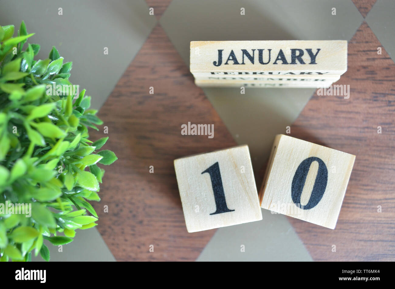 Date of February month with leaf on diamond pattern table for ...