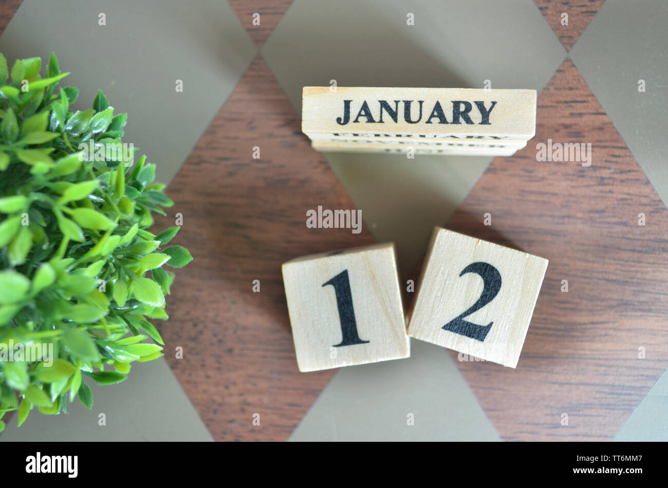 Date of February month with leaf on diamond pattern table for ...