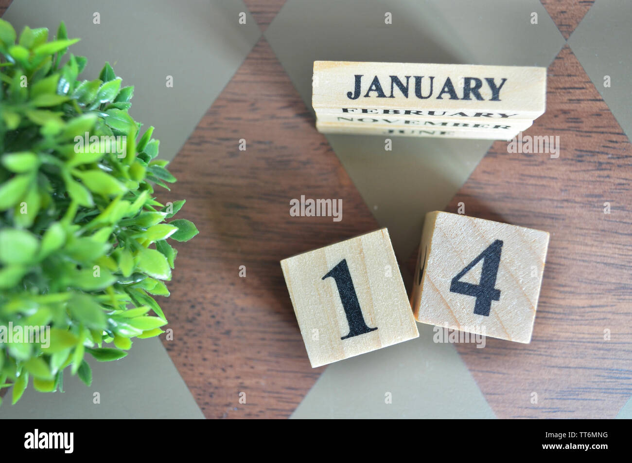 Date of February month with leaf on diamond pattern table for ...