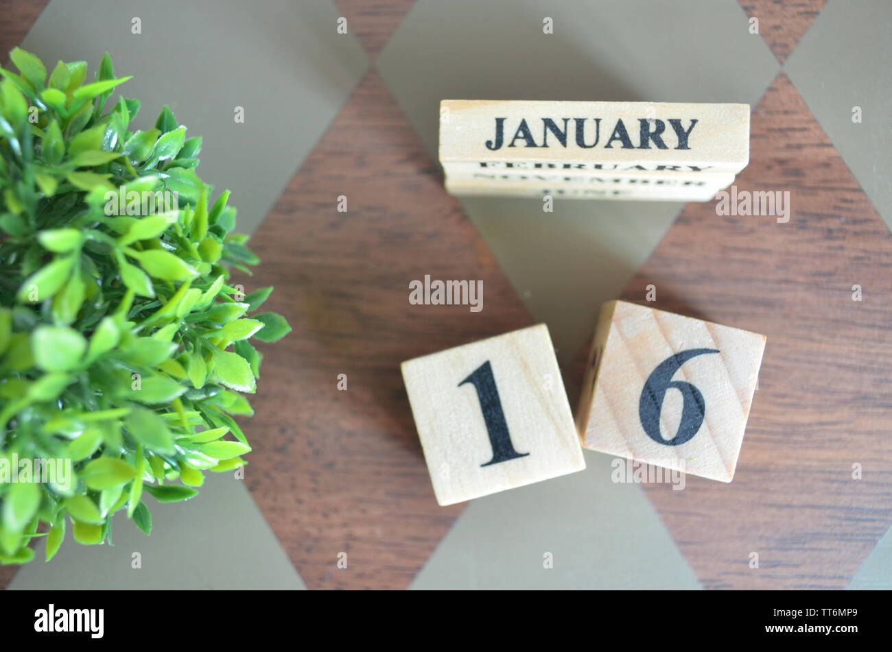 Date of February month with leaf on diamond pattern table for ...