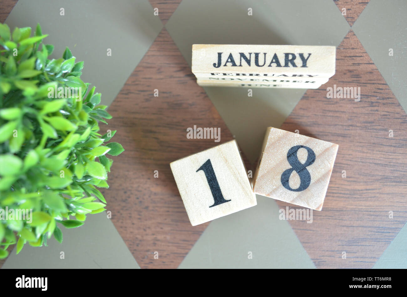 Date of February month with leaf on diamond pattern table for ...