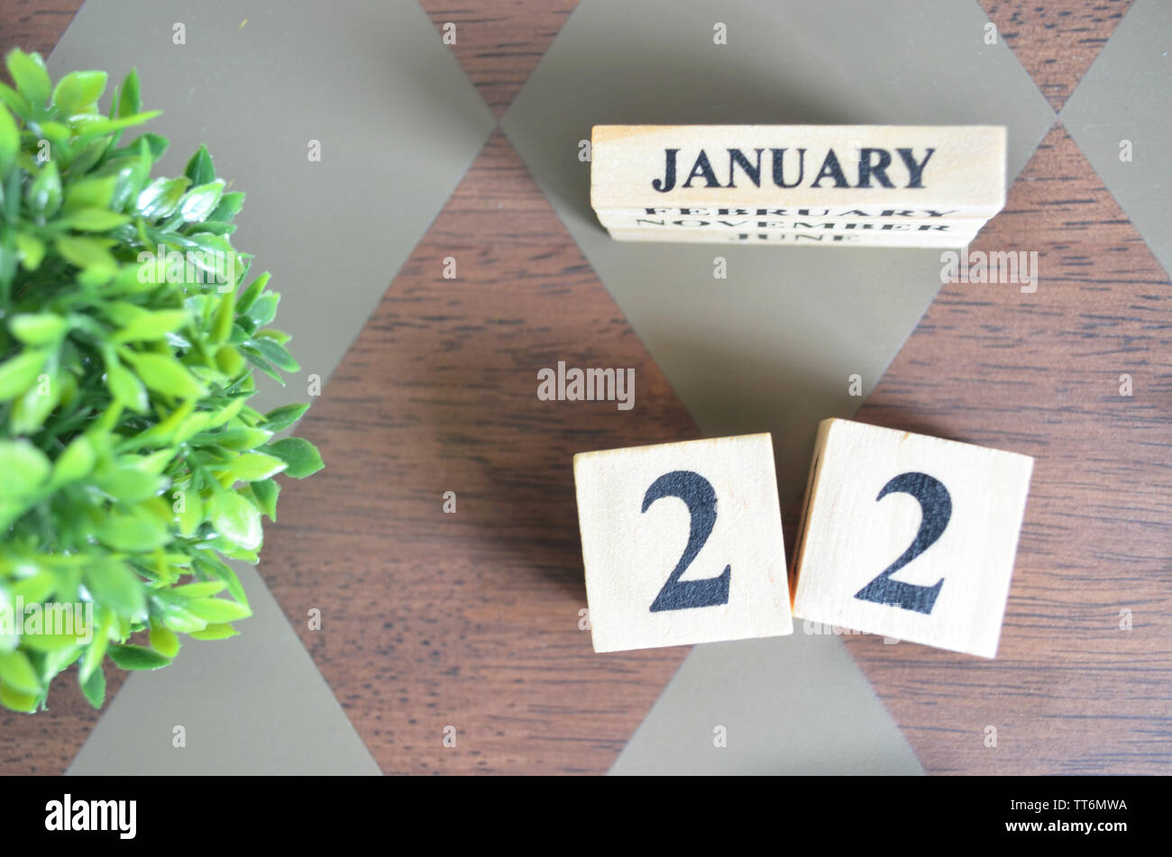 Date of February month with leaf on diamond pattern table for ...