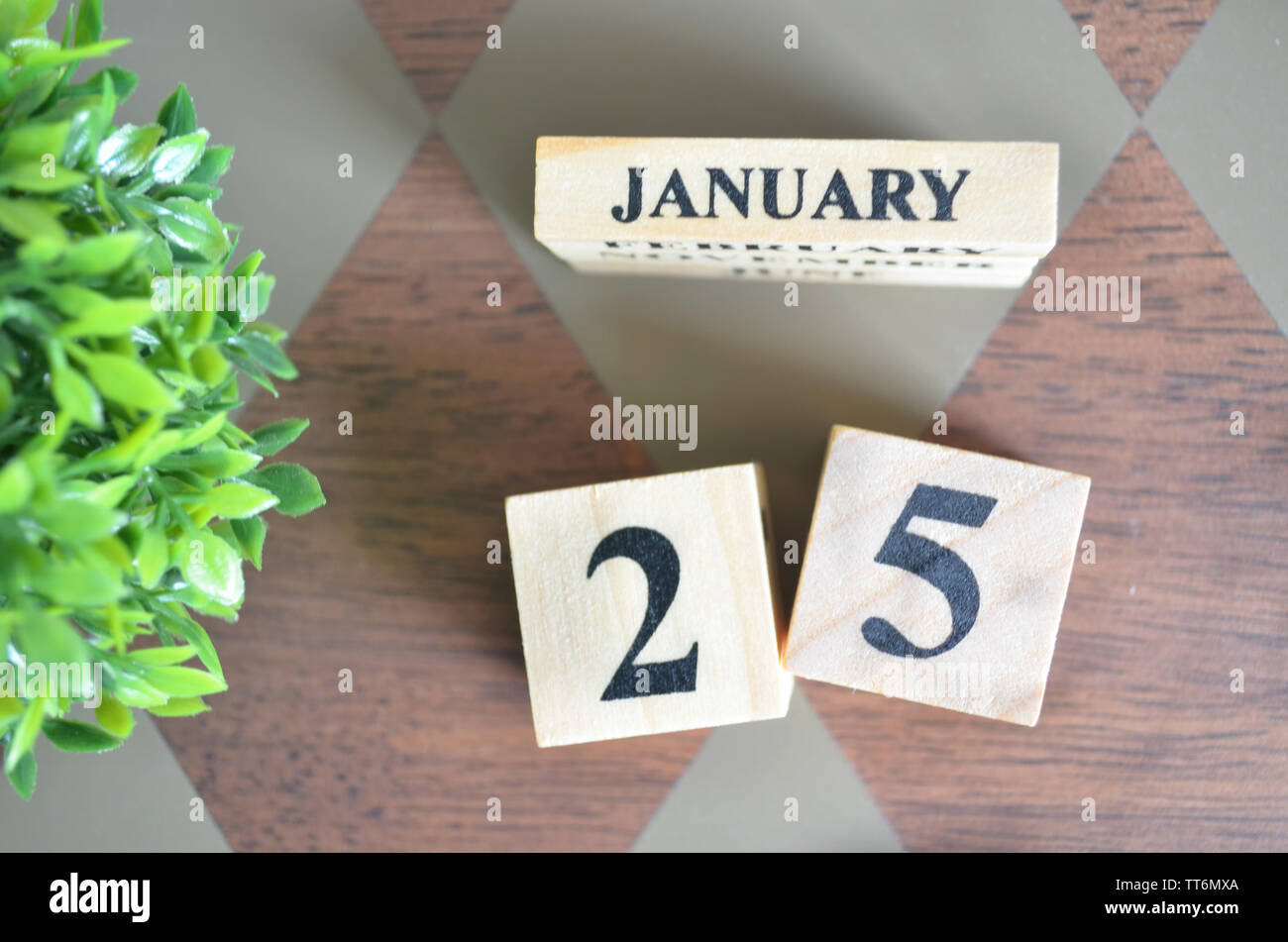 Date of February month with leaf on diamond pattern table for ...