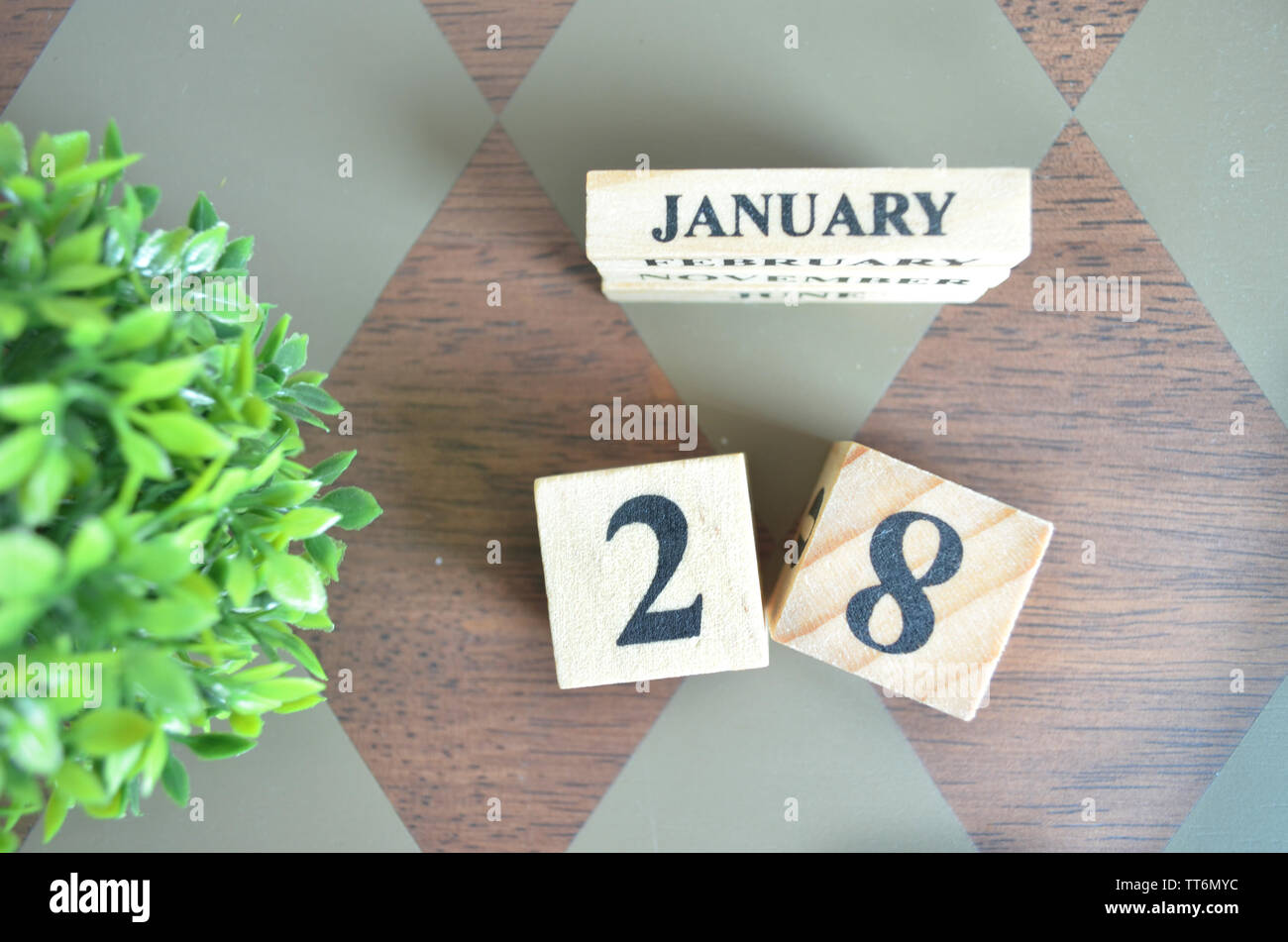 Date of February month with leaf on diamond pattern table for ...