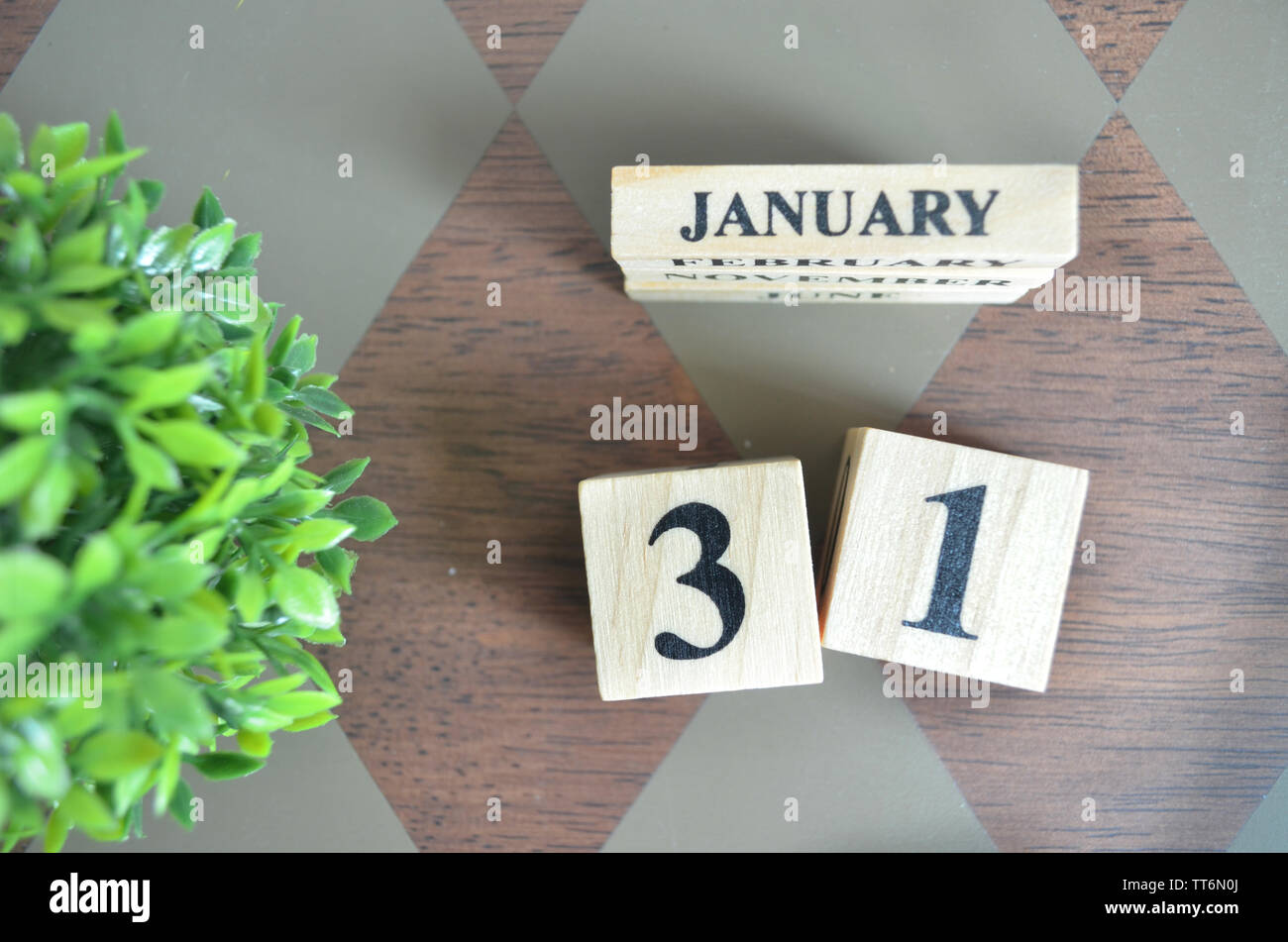 Date of February month with leaf on diamond pattern table for ...
