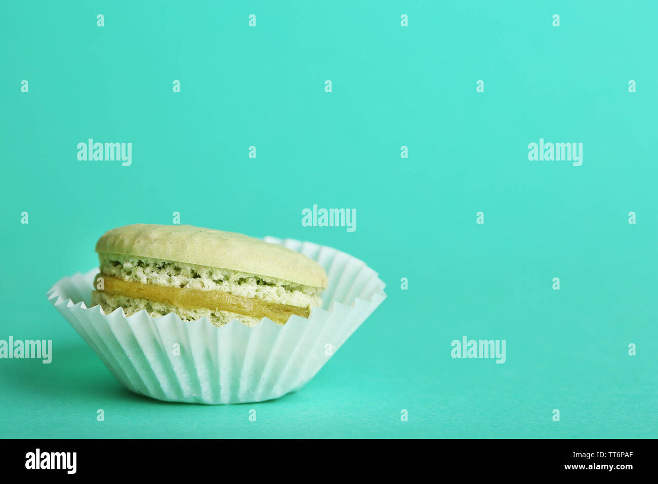 Gentle colorful macaroon on color background Stock Photo - Alamy