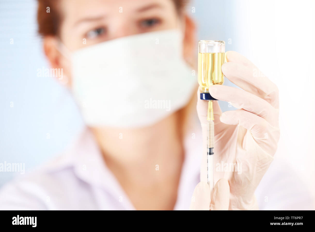 Doctor with medical syringe in hands, getting ready for injection Stock ...
