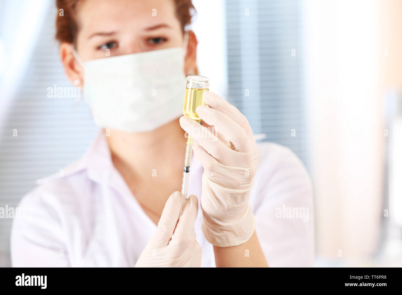 Doctor with medical syringe in hands, getting ready for injection Stock ...