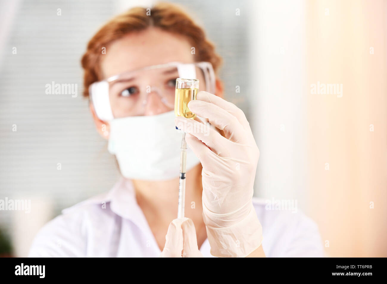 Doctor with medical syringe in hands, getting ready for injection Stock ...