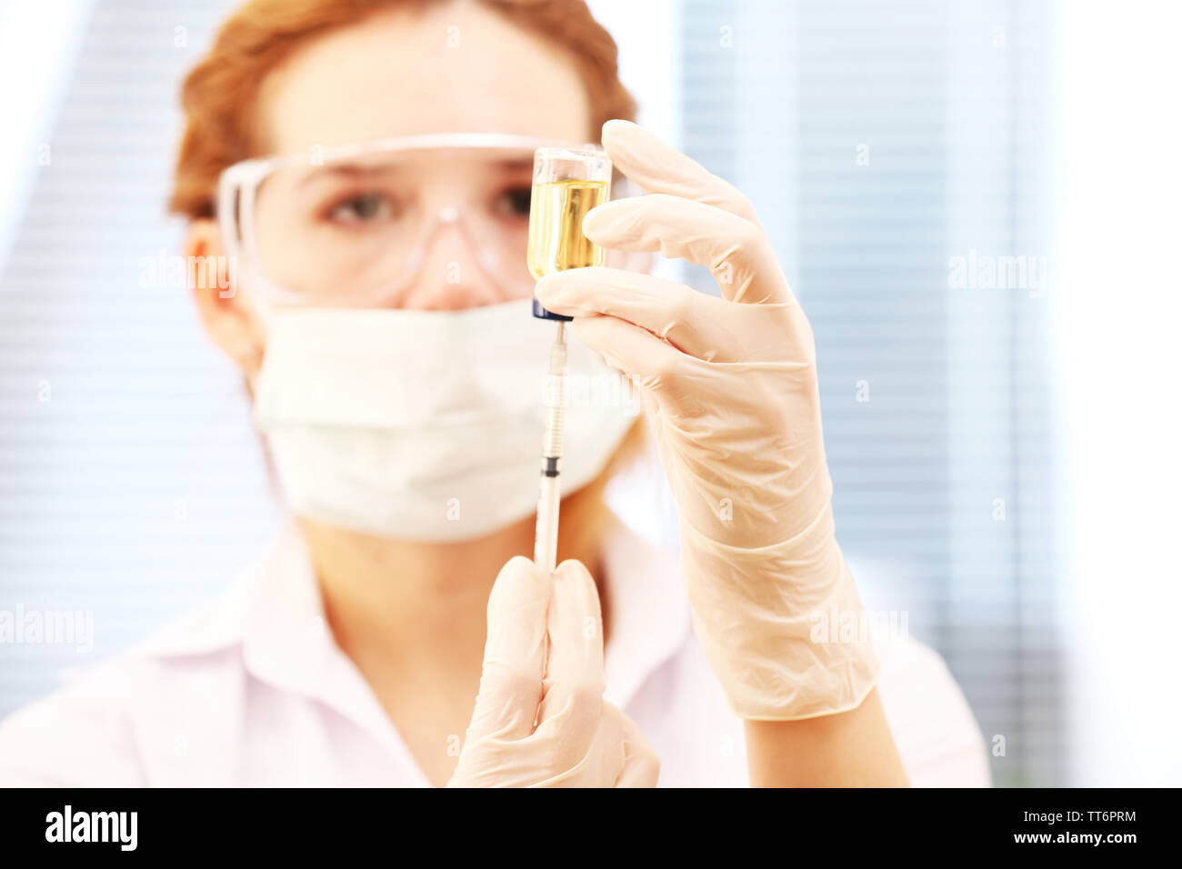 Doctor with medical syringe in hands, getting ready for injection Stock ...