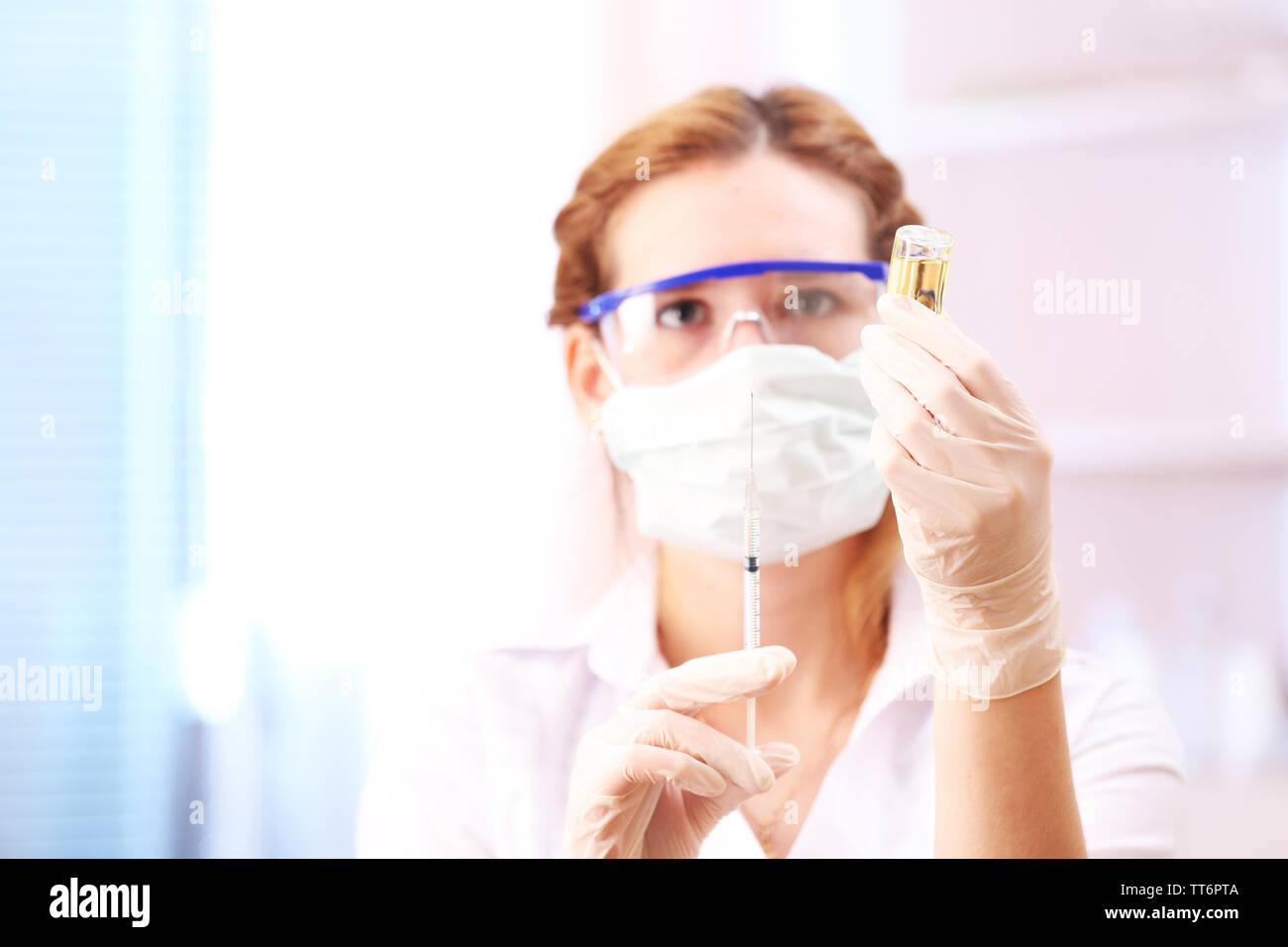 Doctor with medical syringe in hands, getting ready for injection Stock ...