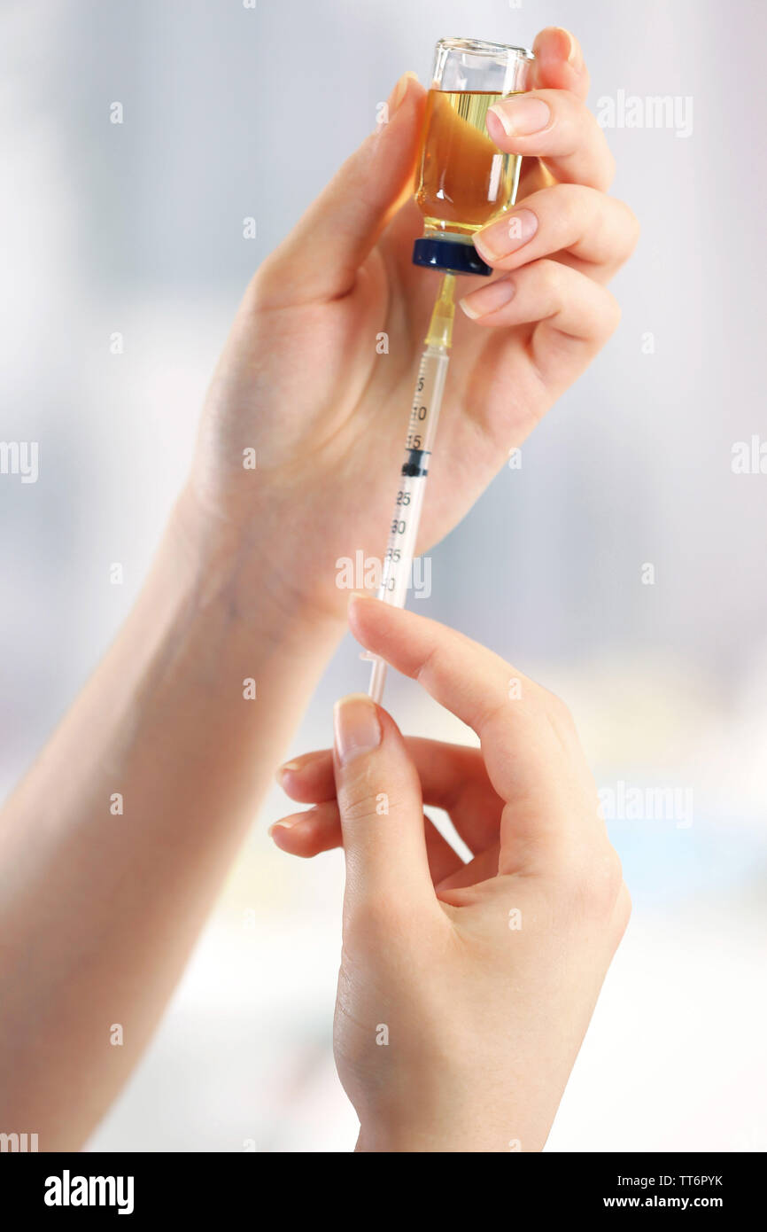 Doctor with medical syringe in hands, getting ready for injection Stock ...