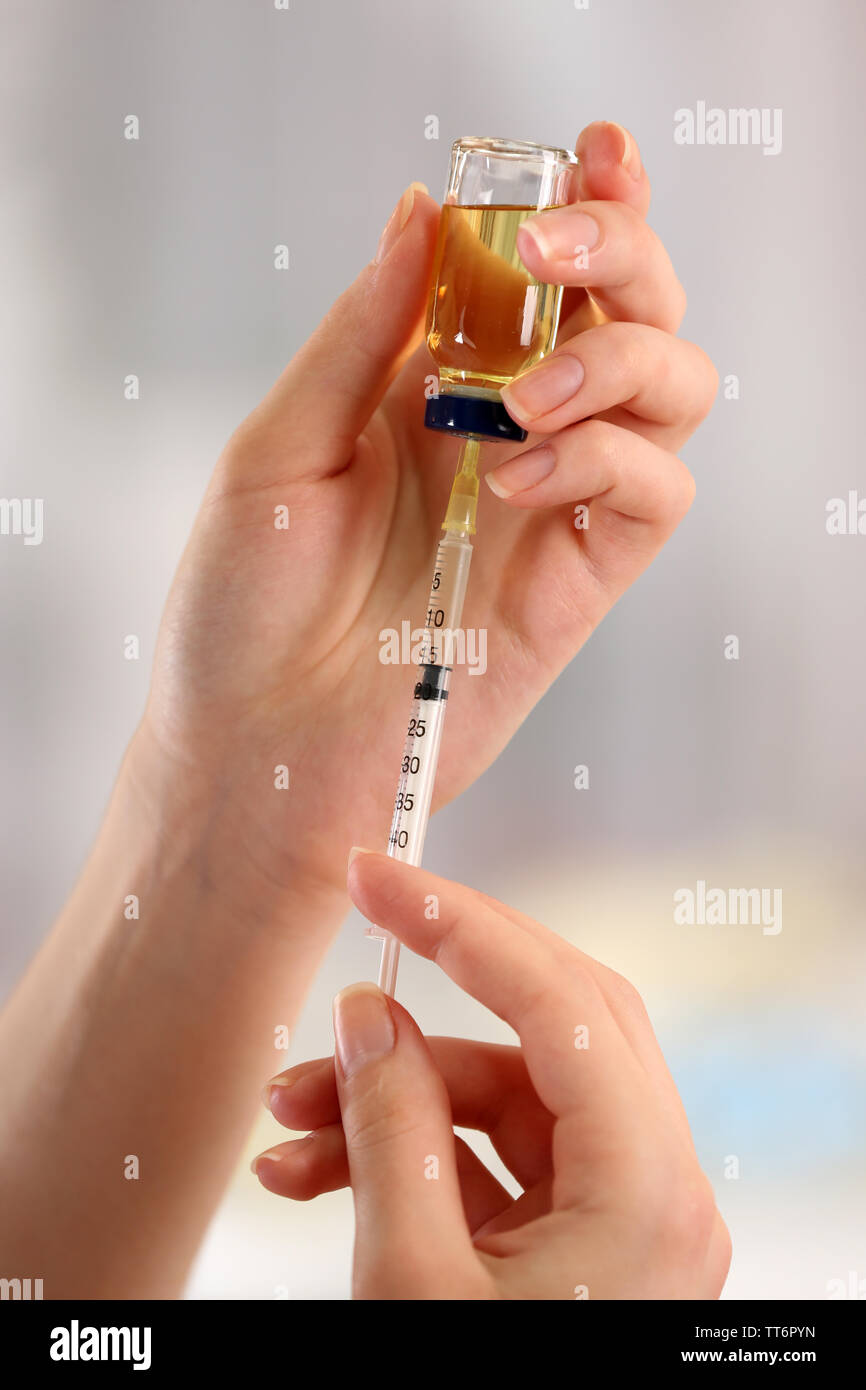 Doctor with medical syringe in hands, getting ready for injection Stock ...