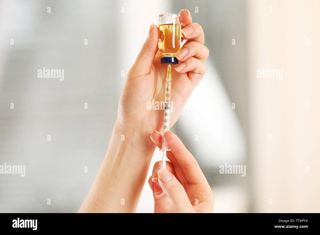 Doctor with medical syringe in hands, getting ready for injection Stock ...