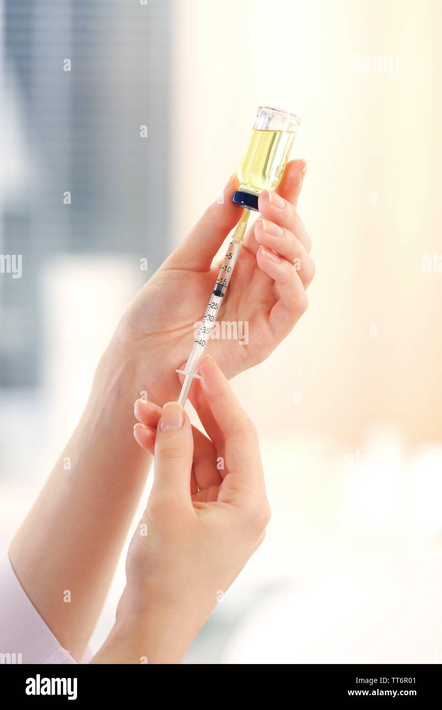 Doctor with medical syringe in hands, getting ready for injection Stock ...