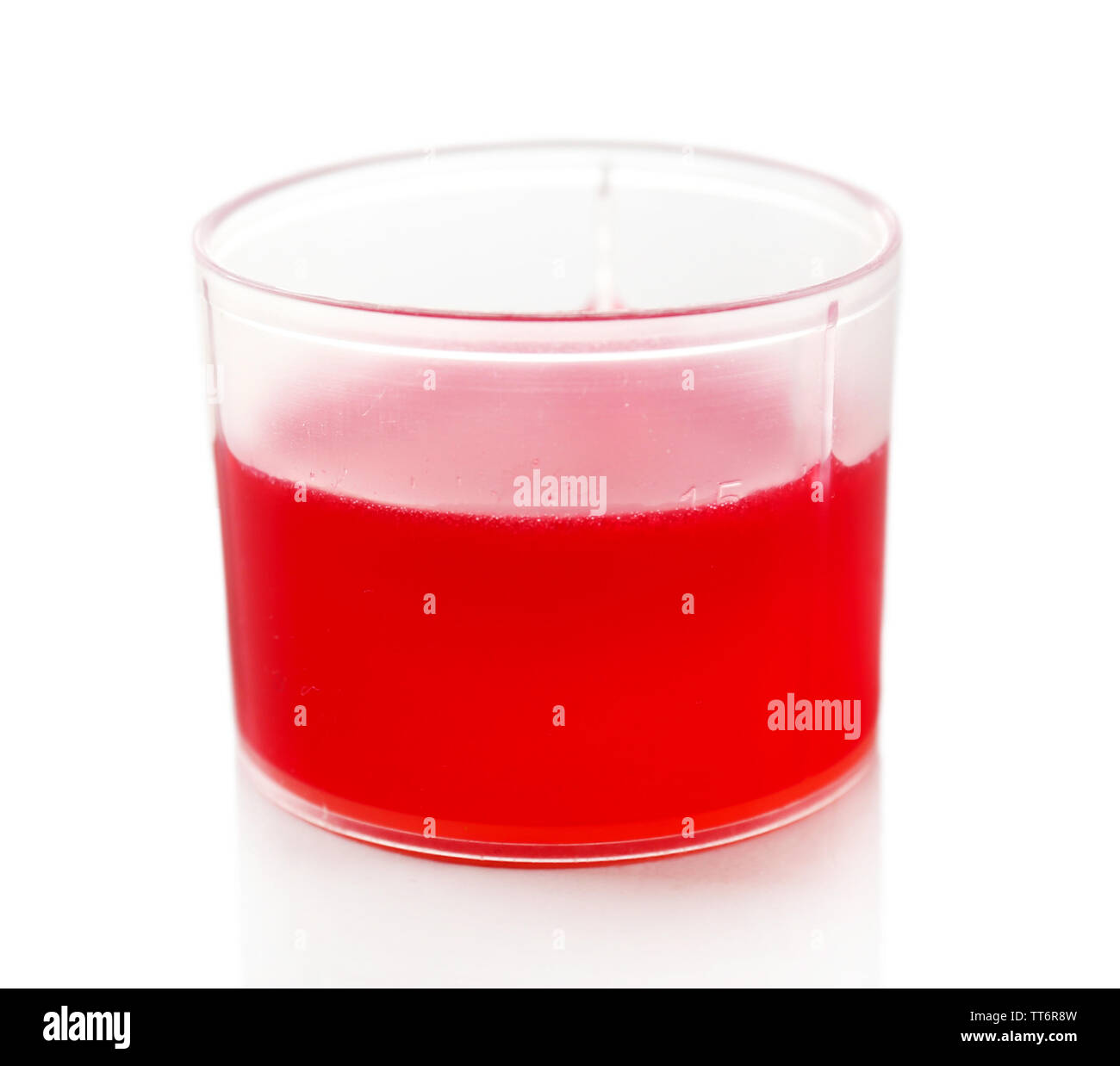 Cough syrup in cup isolated on white Stock Photo - Alamy