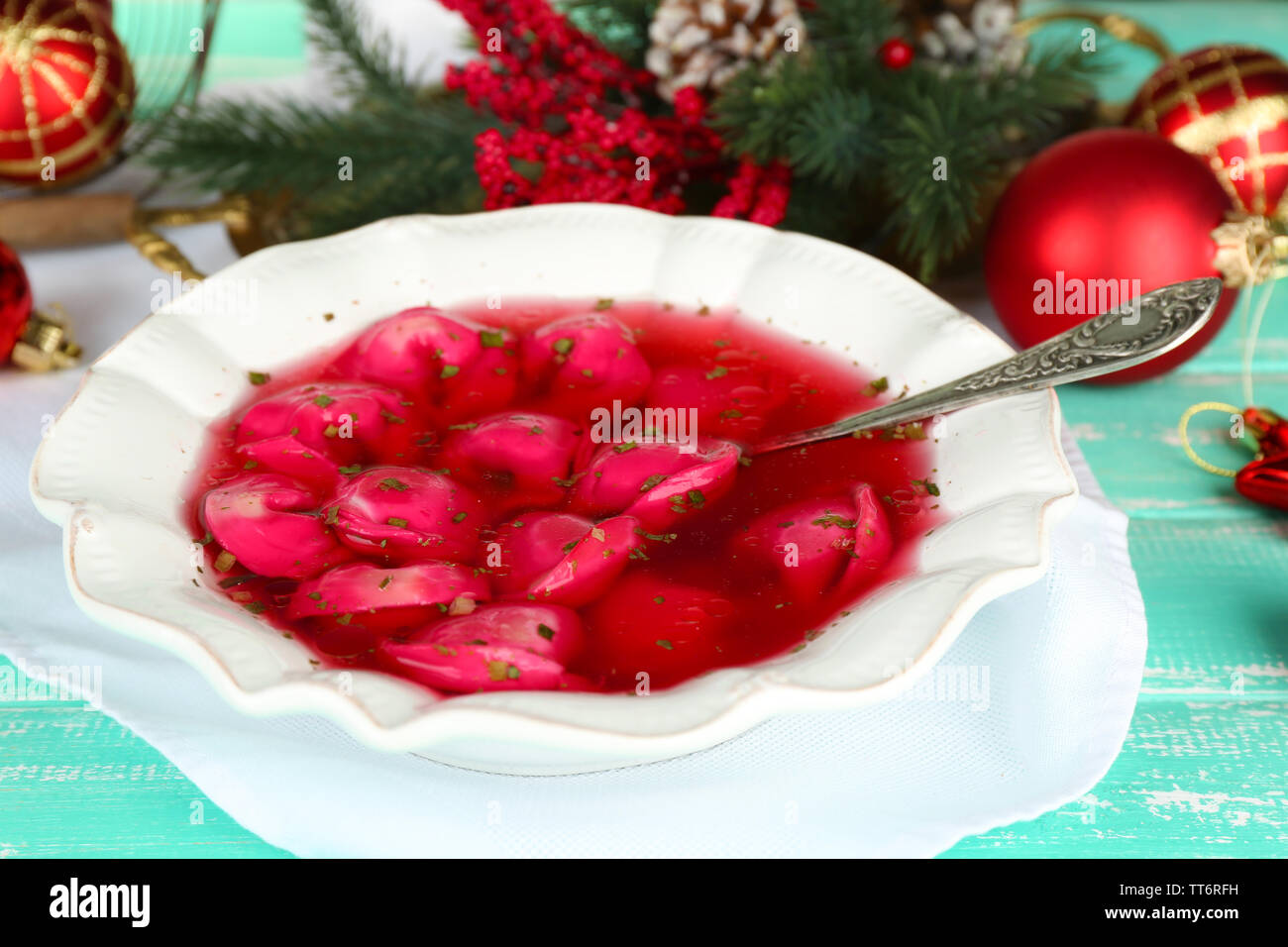 Traditional polish clear red borscht with dumplings and Christmas ...