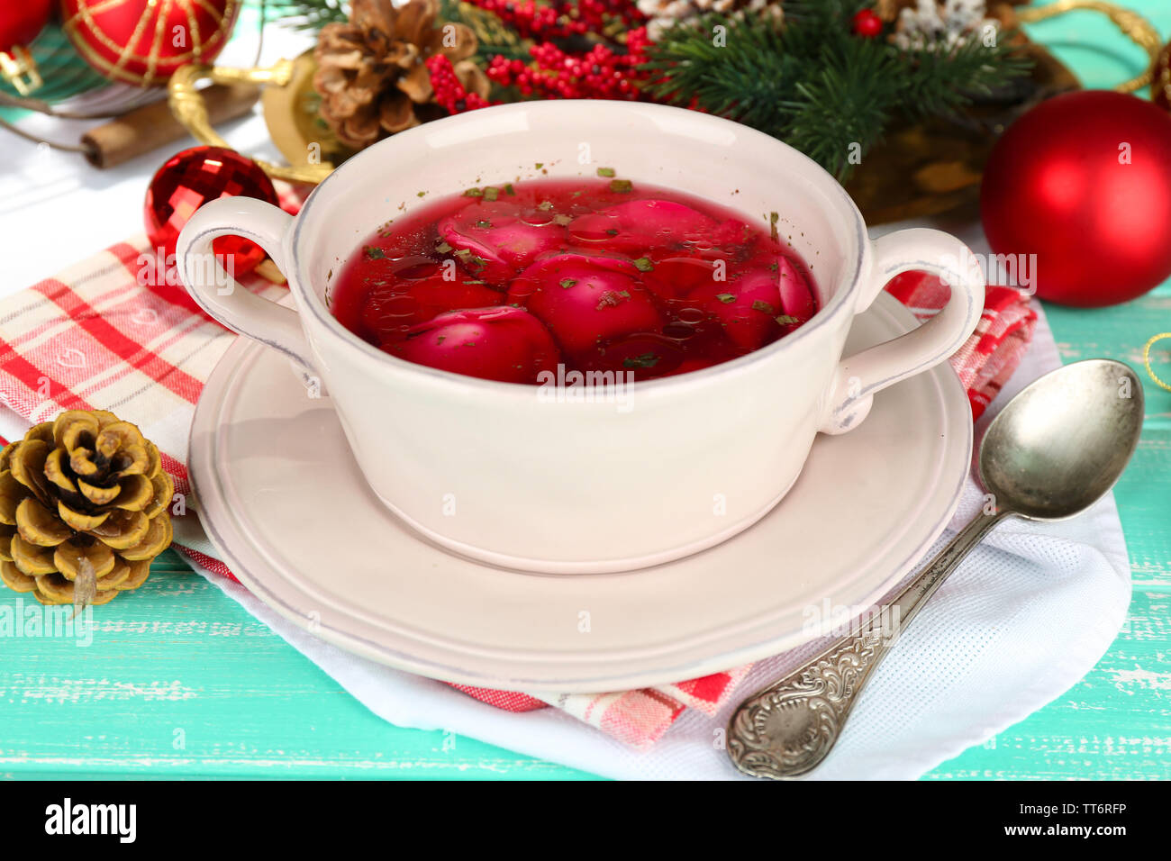 Traditional polish clear red borscht with dumplings and Christmas ...