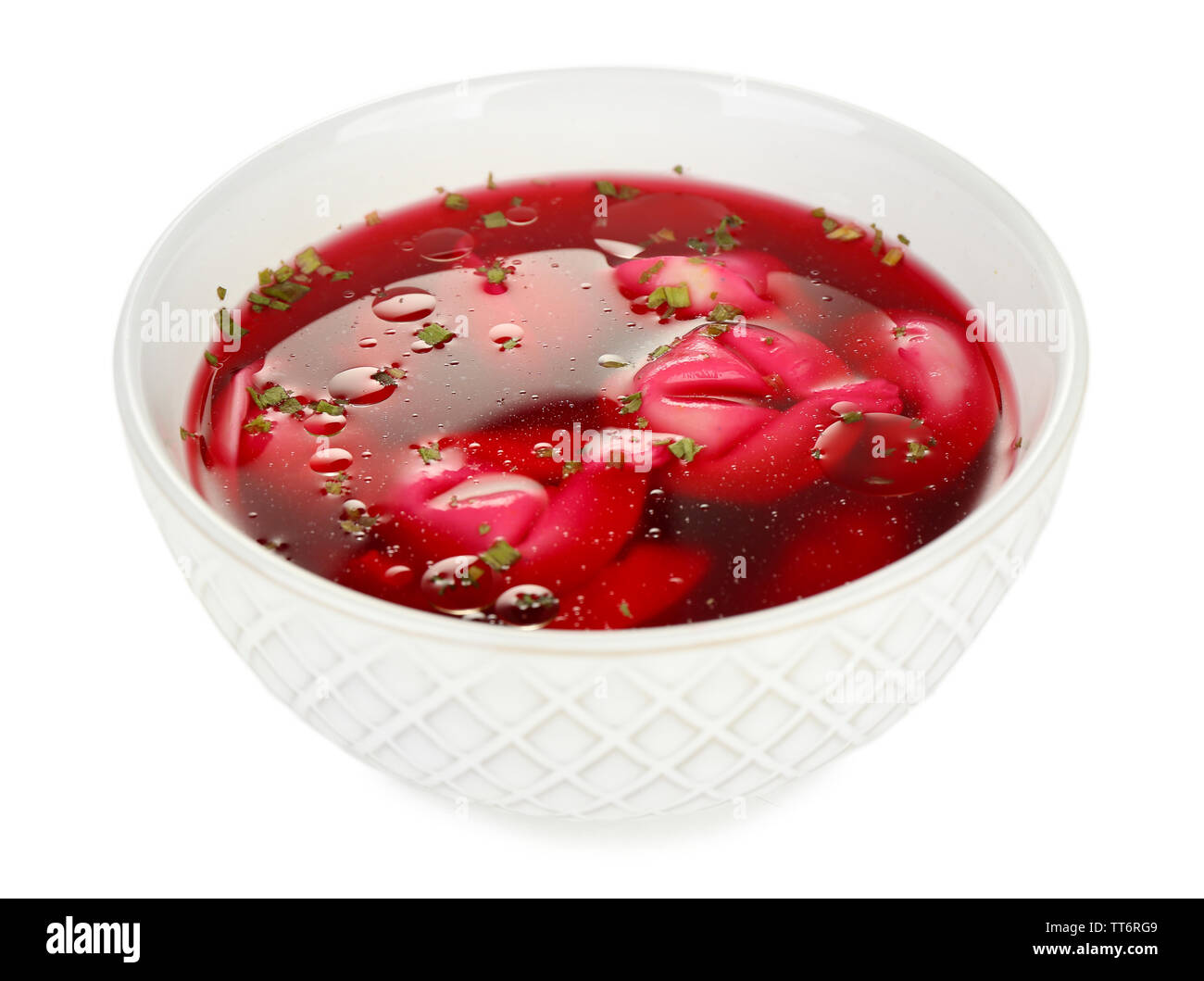 Traditional polish clear red borscht with dumplings isolated on white ...