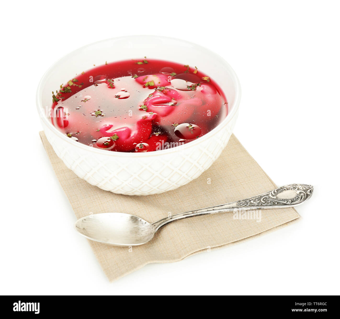 Traditional polish clear red borscht with dumplings isolated on white ...