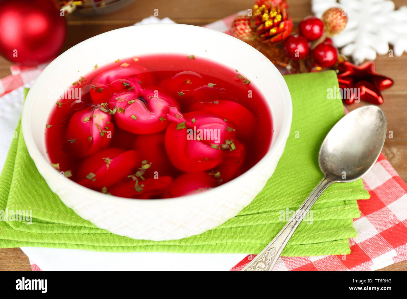 Traditional polish clear red borscht with dumplings and Christmas ...