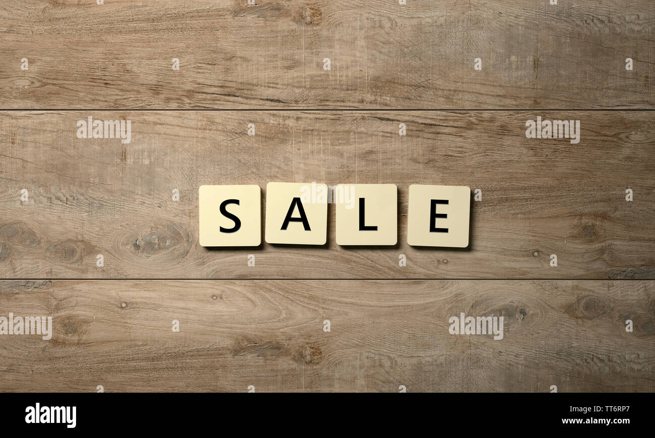 SALE symbol on wooden table - Illustration Stock Photo - Alamy