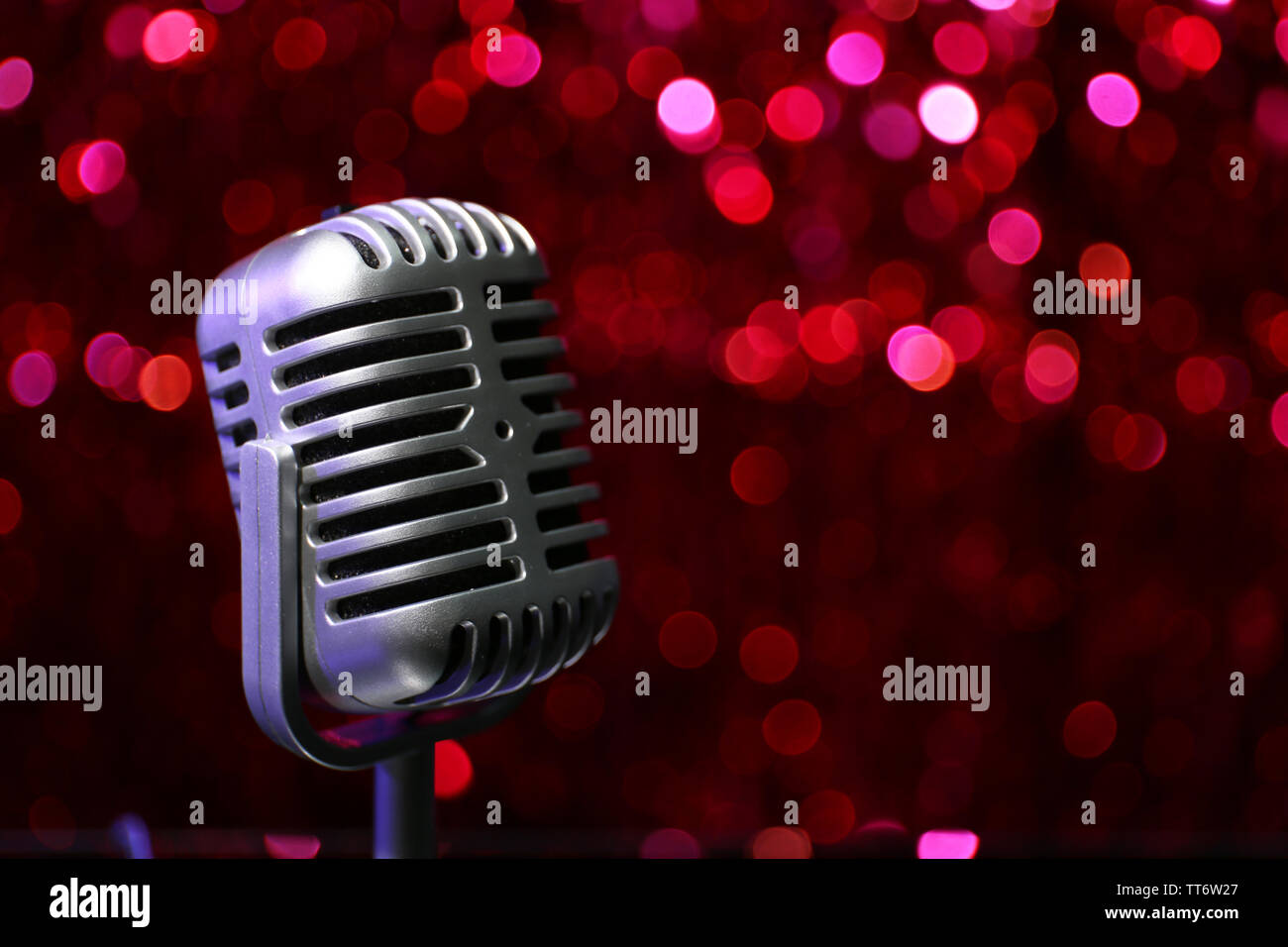 Silver microphone on red background Stock Photo - Alamy