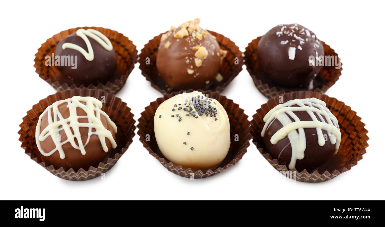 Delicious chocolate candies isolated on white Stock Photo - Alamy