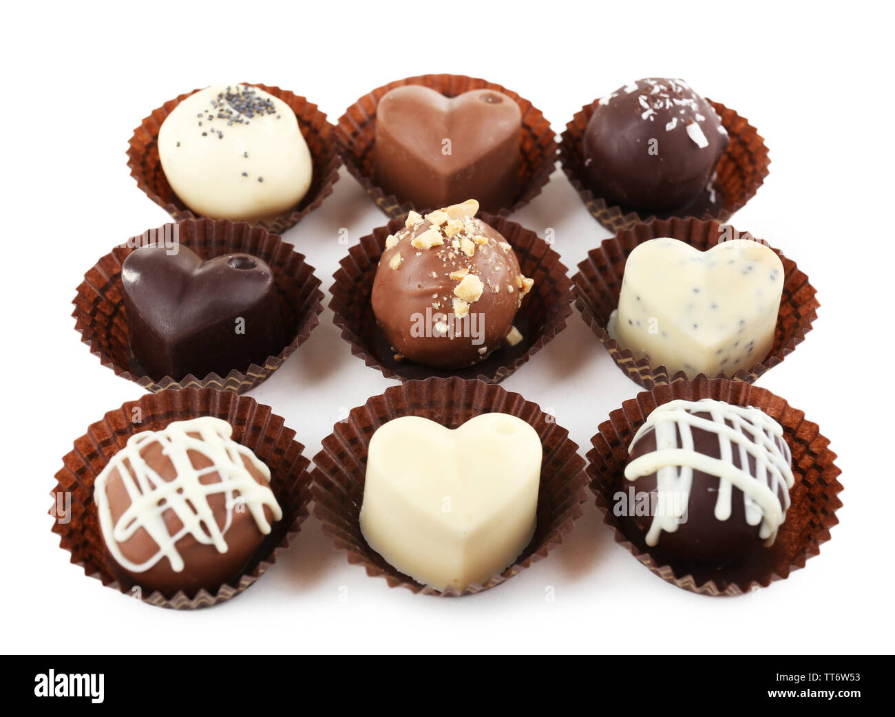 Delicious chocolate candies isolated on white Stock Photo - Alamy