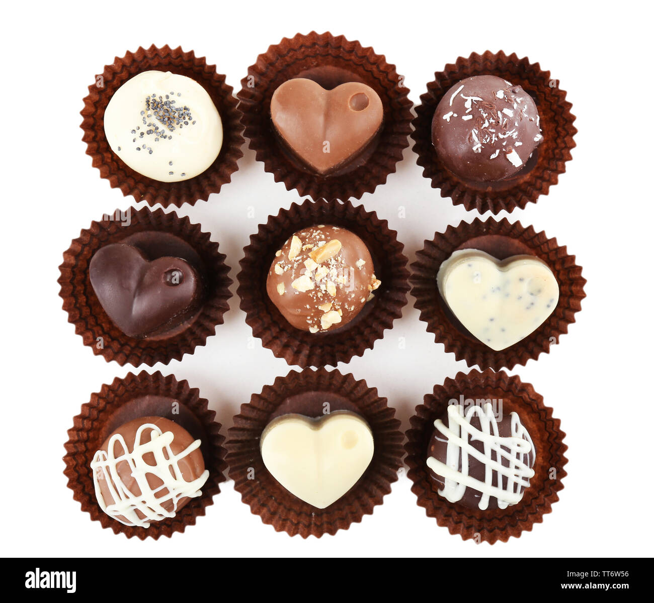 Delicious chocolate candies isolated on white Stock Photo - Alamy