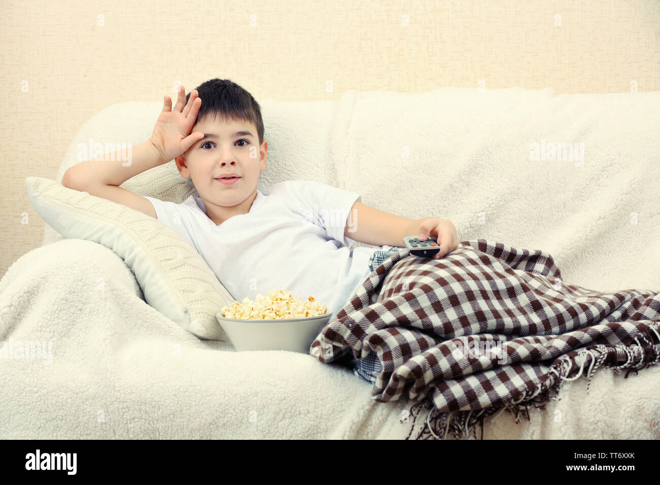 Boy watching TV Stock Photo - Alamy