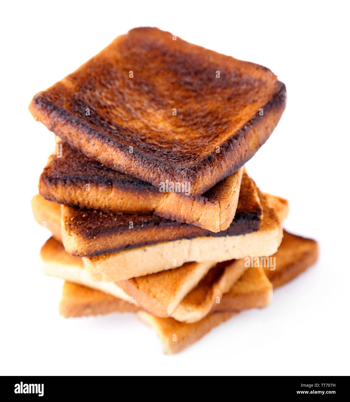 Burnt toast bread isolated on white background Stock Photo - Alamy