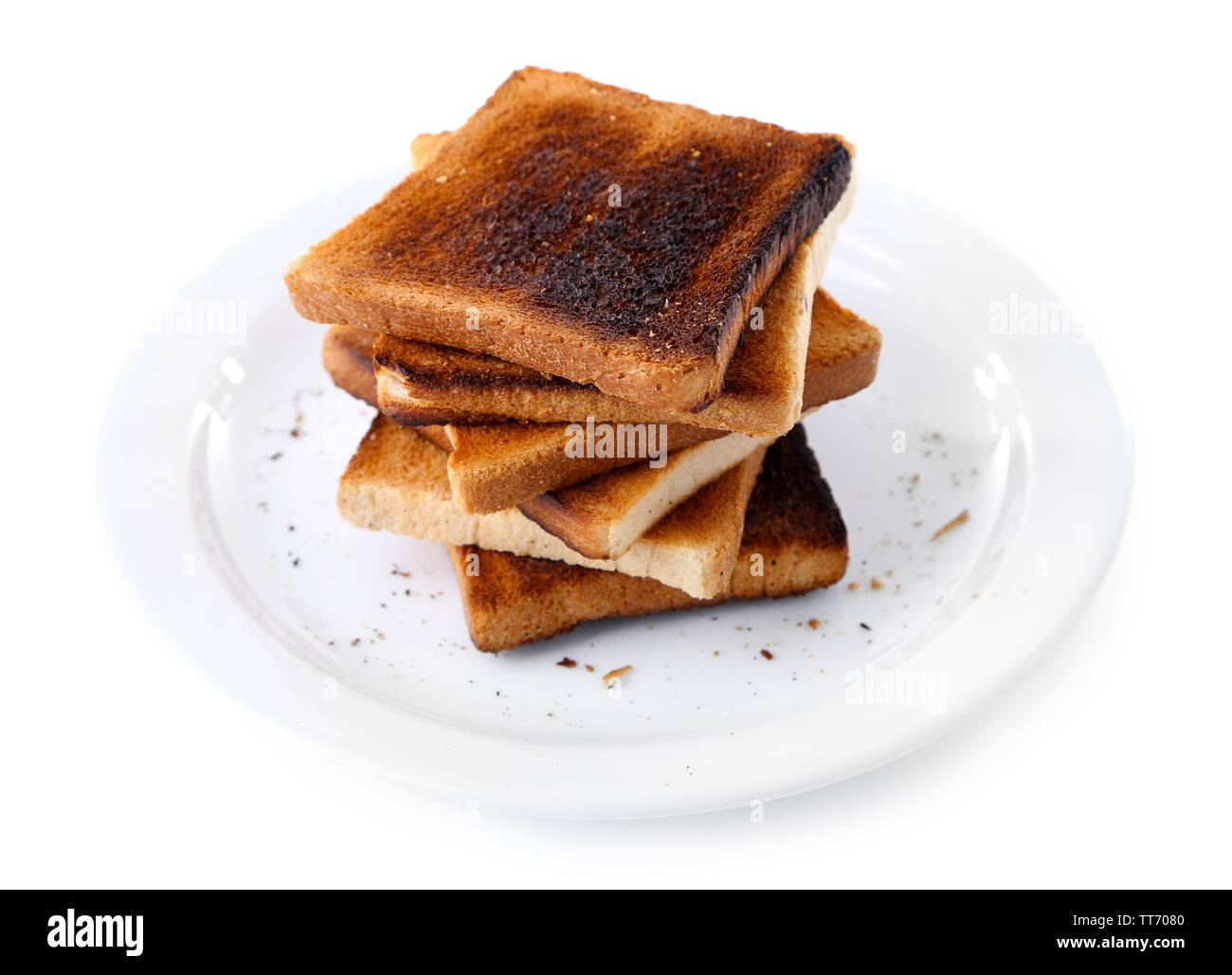 Burnt toast bread on plate, isolated on white background Stock Photo ...
