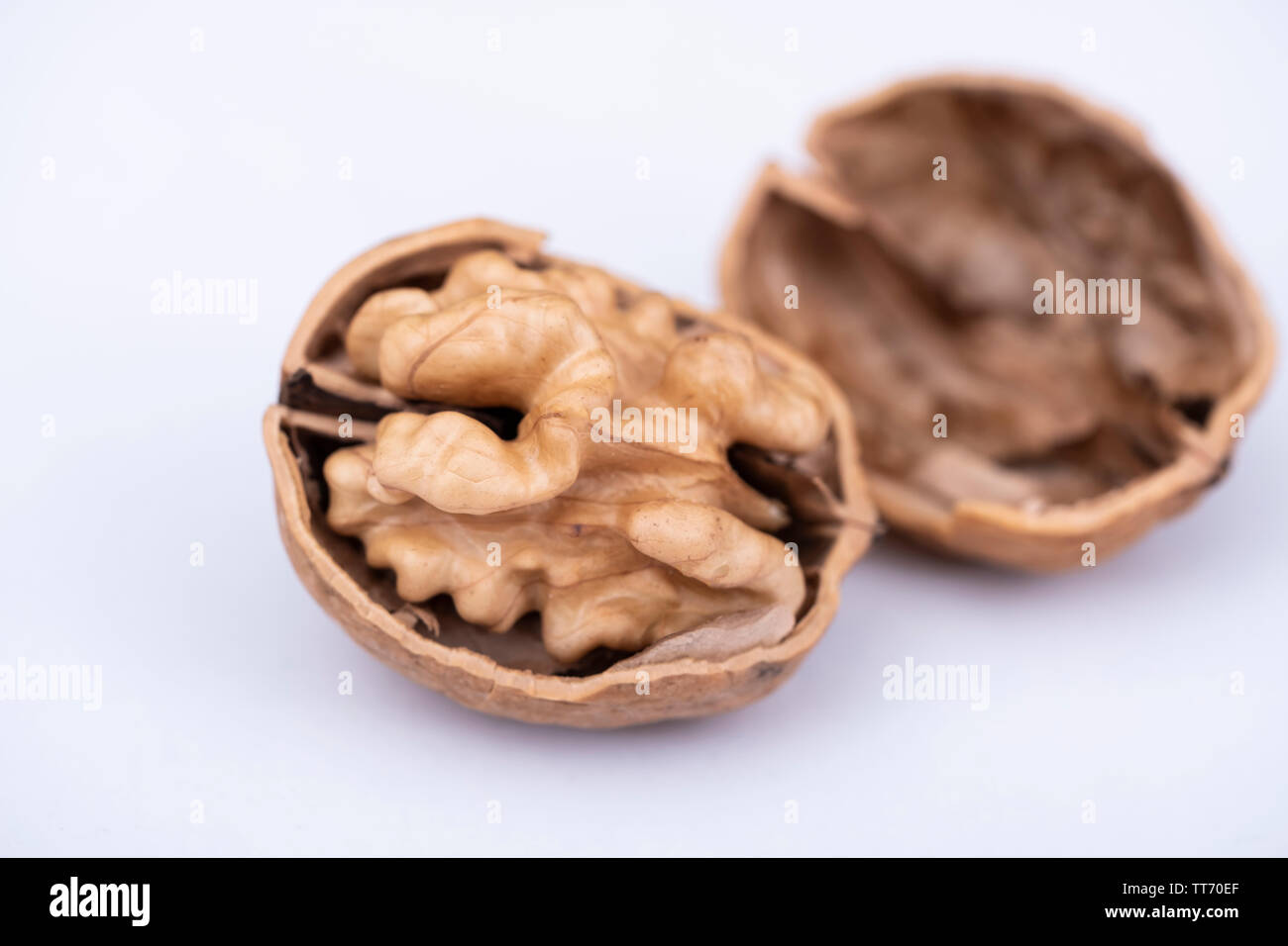 Half walnut kernel whole walnuts hi-res stock photography and images - Alamy
