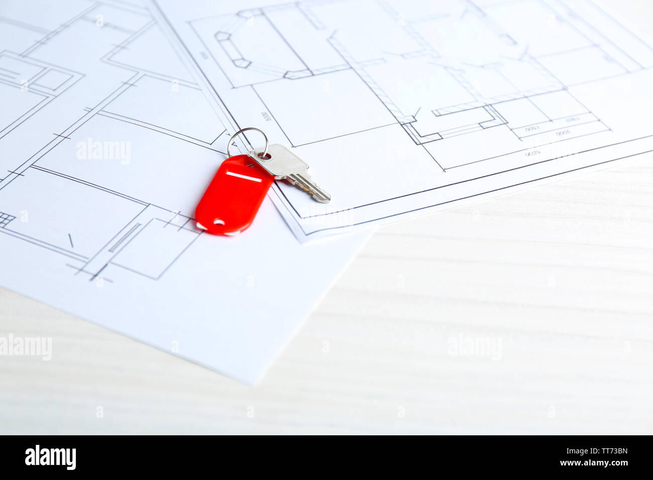 Key on house plan close-up Stock Photo - Alamy