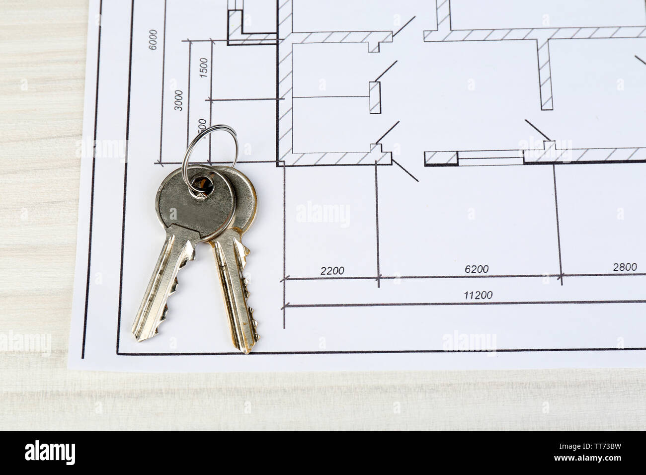 Key on house plan close-up Stock Photo - Alamy