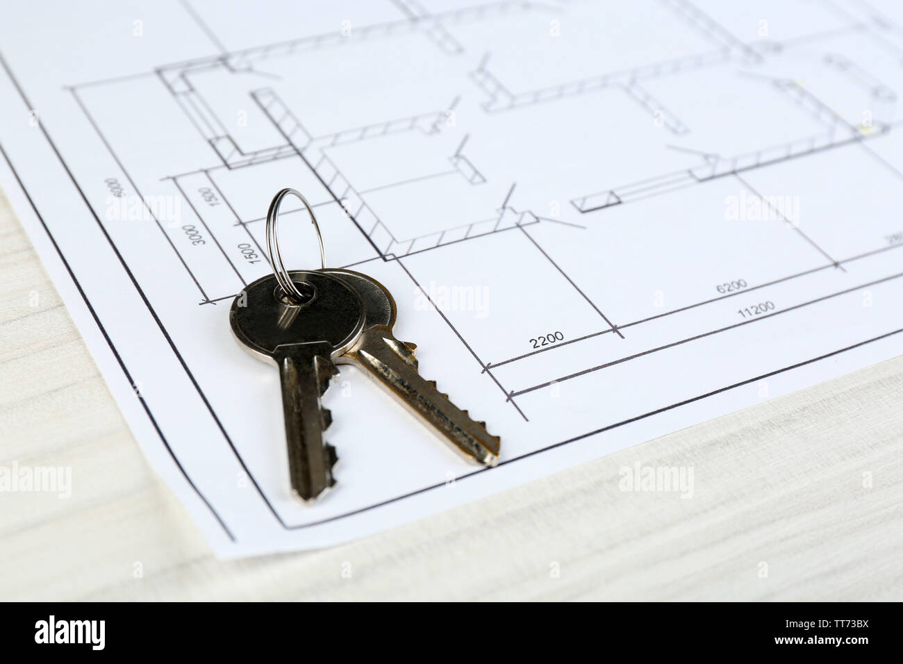 Key on house plan close-up Stock Photo - Alamy
