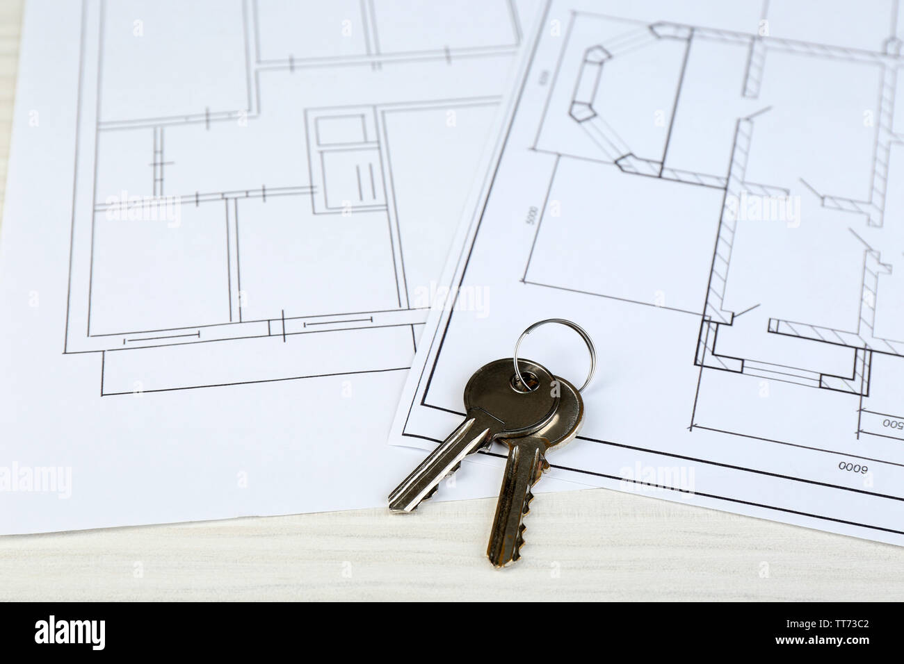 Key on house plan close-up Stock Photo - Alamy