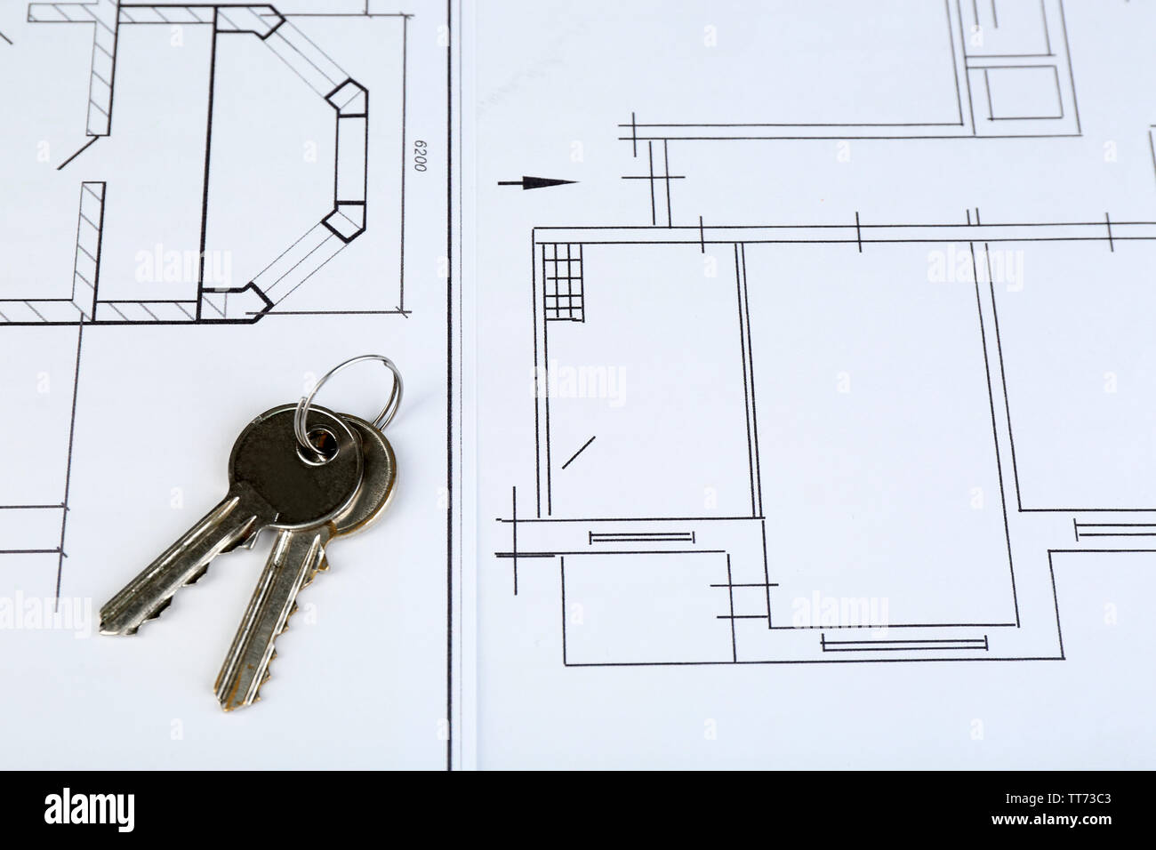 Key on house plan close-up Stock Photo - Alamy