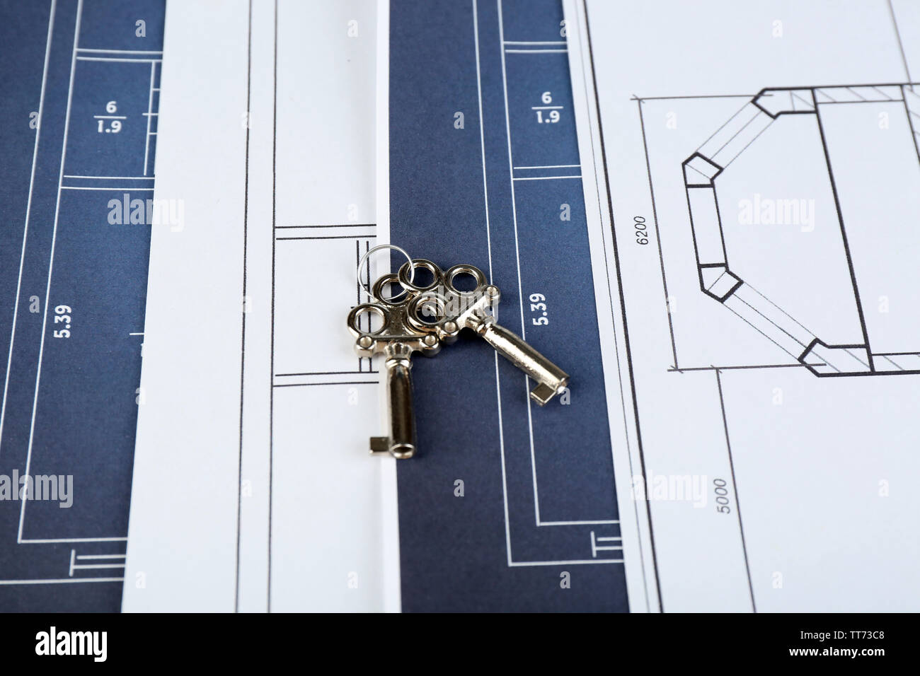 Key on house plan close-up Stock Photo - Alamy