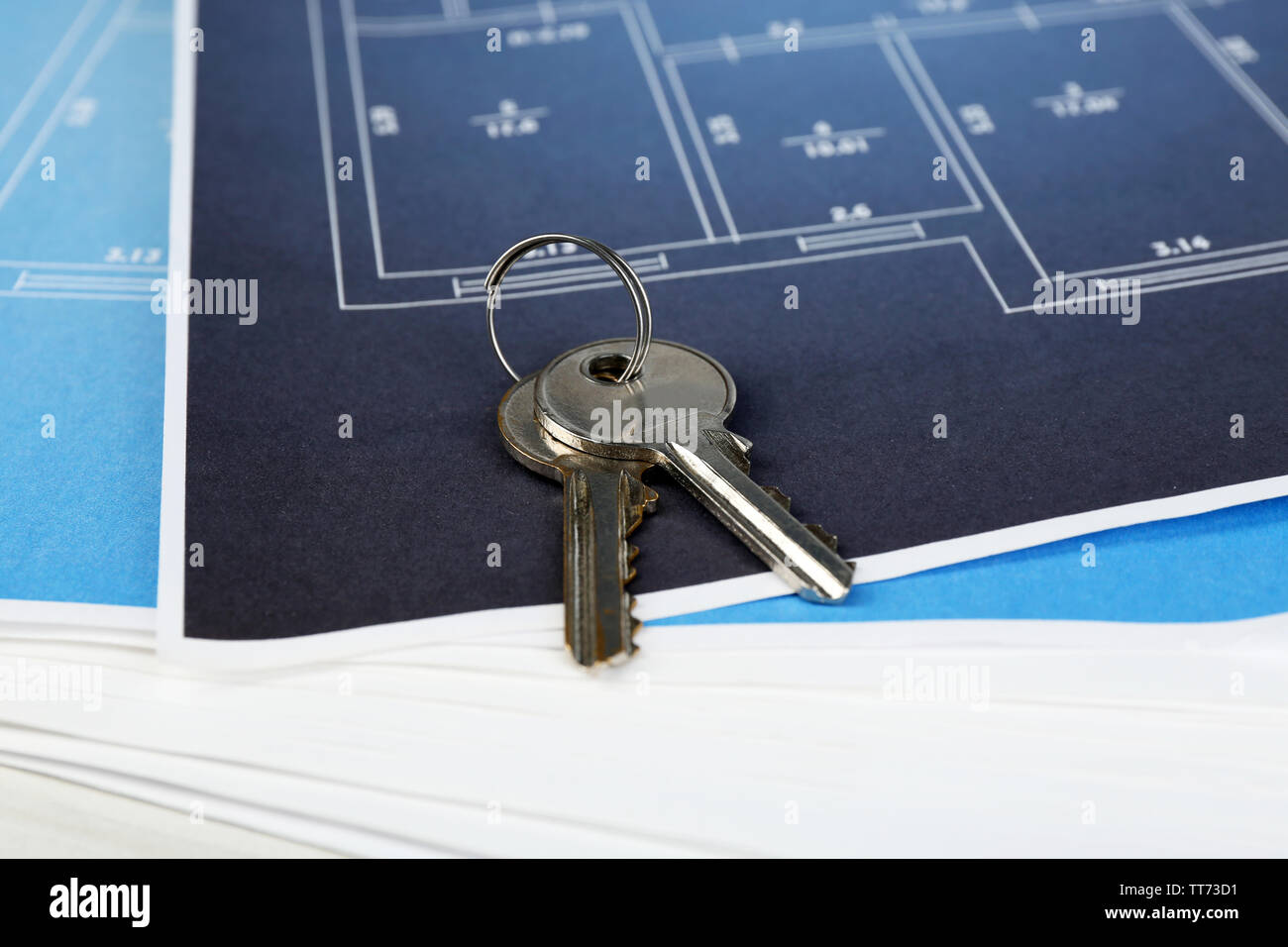 Key on house plan close-up Stock Photo - Alamy
