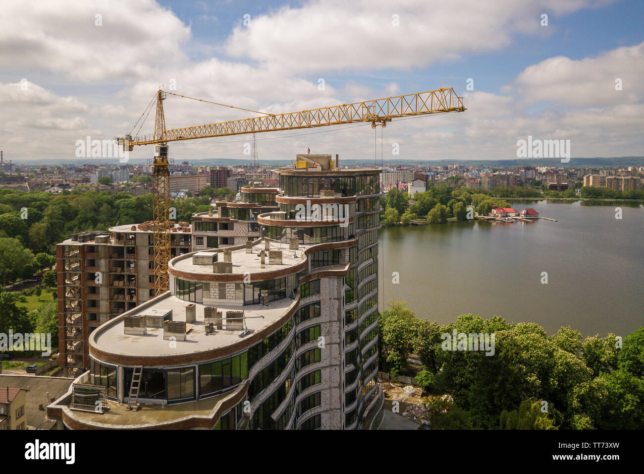 Apartment or office tall building unfinished under construction among ...