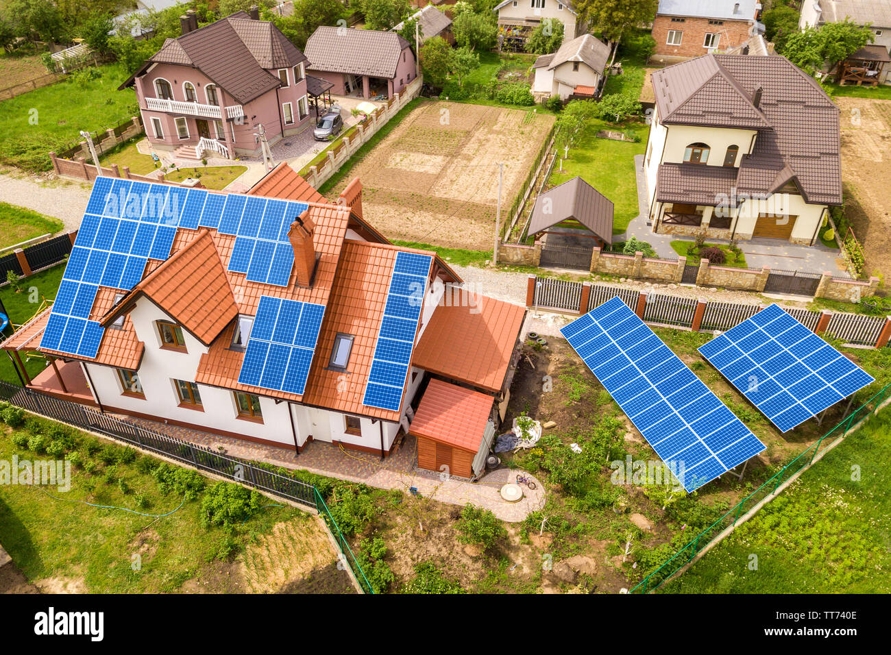 Aerial top view of new modern residential house cottage with blue shiny ...
