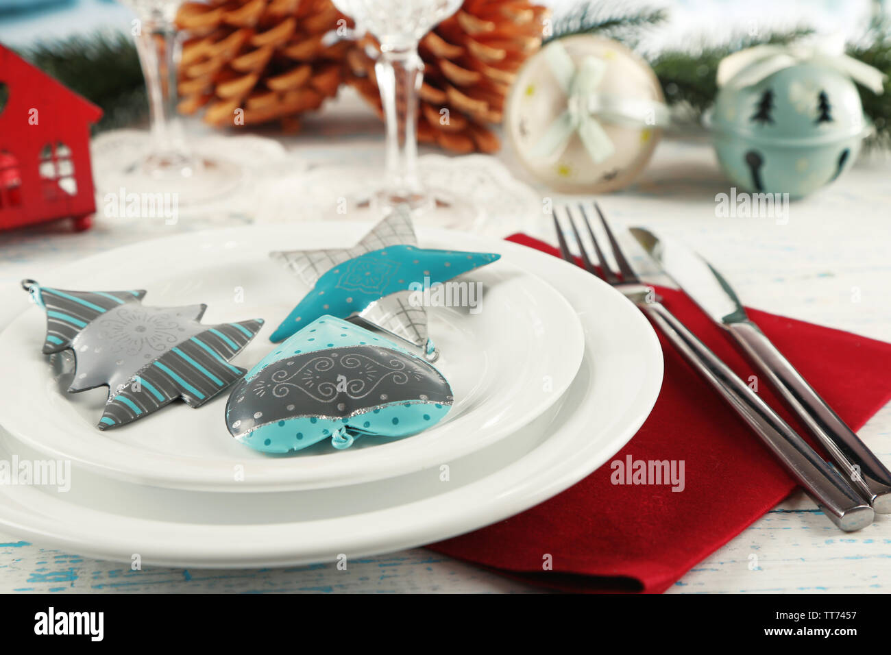 Holiday table setting with Christmas decoration and light background ...