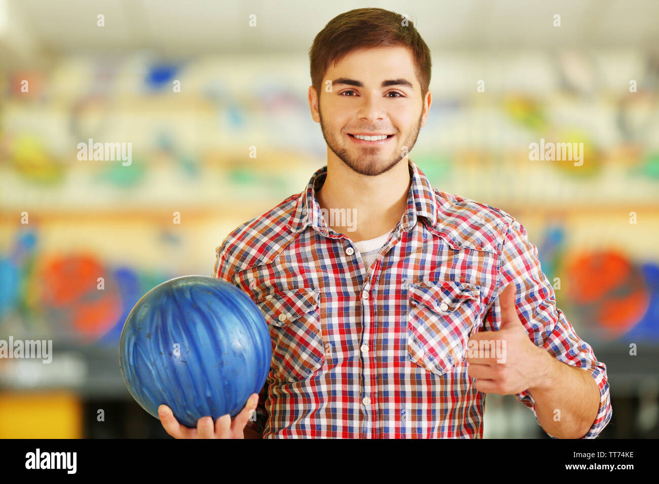 Male with bowling ball in club Stock Photo - Alamy