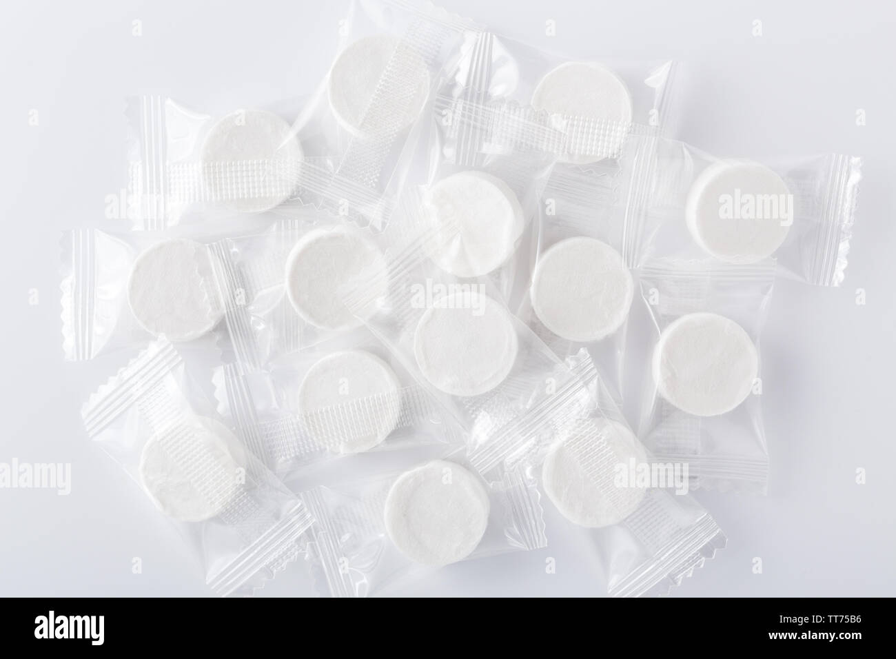 Compressed dry facial mask in package on white background Stock Photo ...