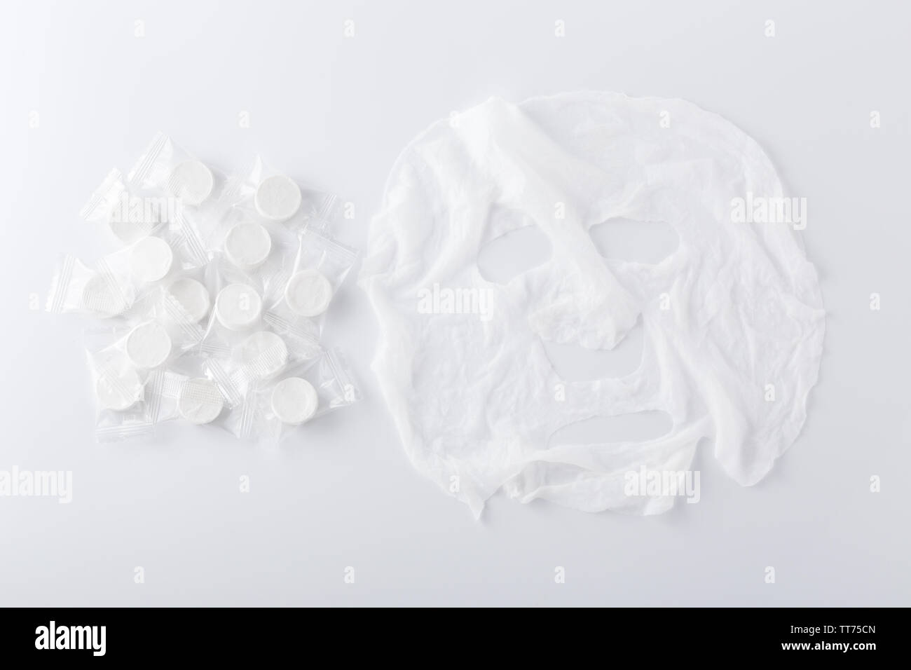 Facial mask and dry sheet mask compressed on white background Stock ...