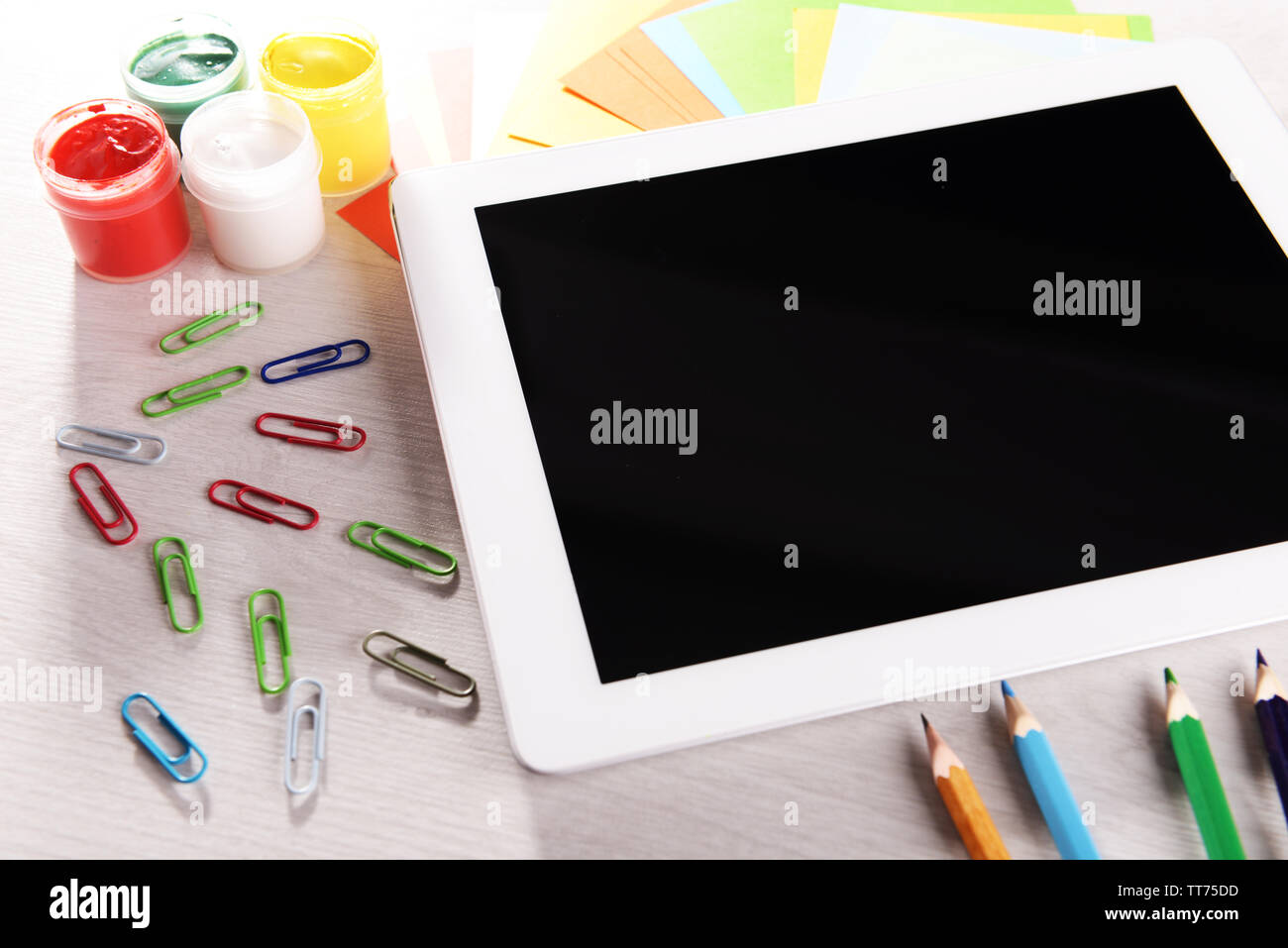 Tablet PC with watercolor on desktop background Stock Photo - Alamy