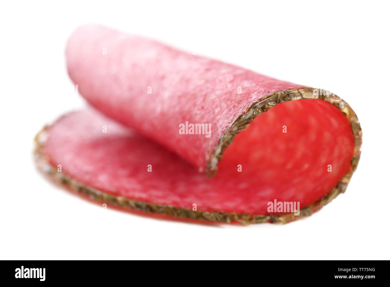 Slice of salami isolated on white background Stock Photo - Alamy